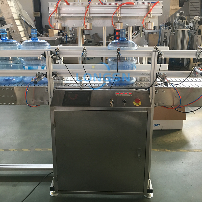Leak testing machine for small containers and bottles